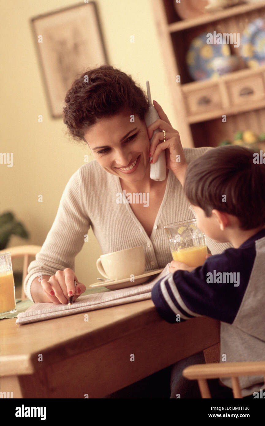 Multi tasking mother Stock Photo - Alamy
