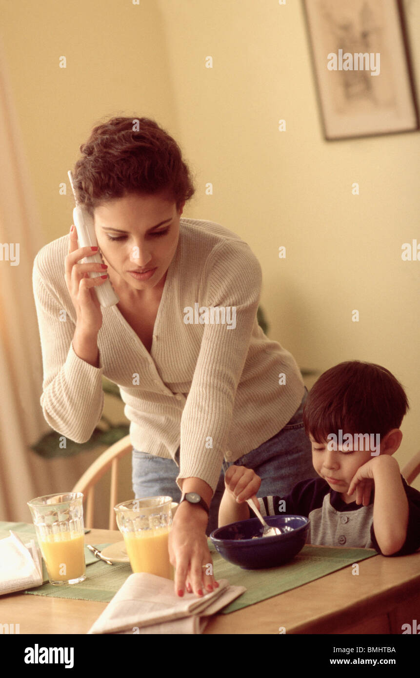 Multi tasking mother Stock Photo - Alamy