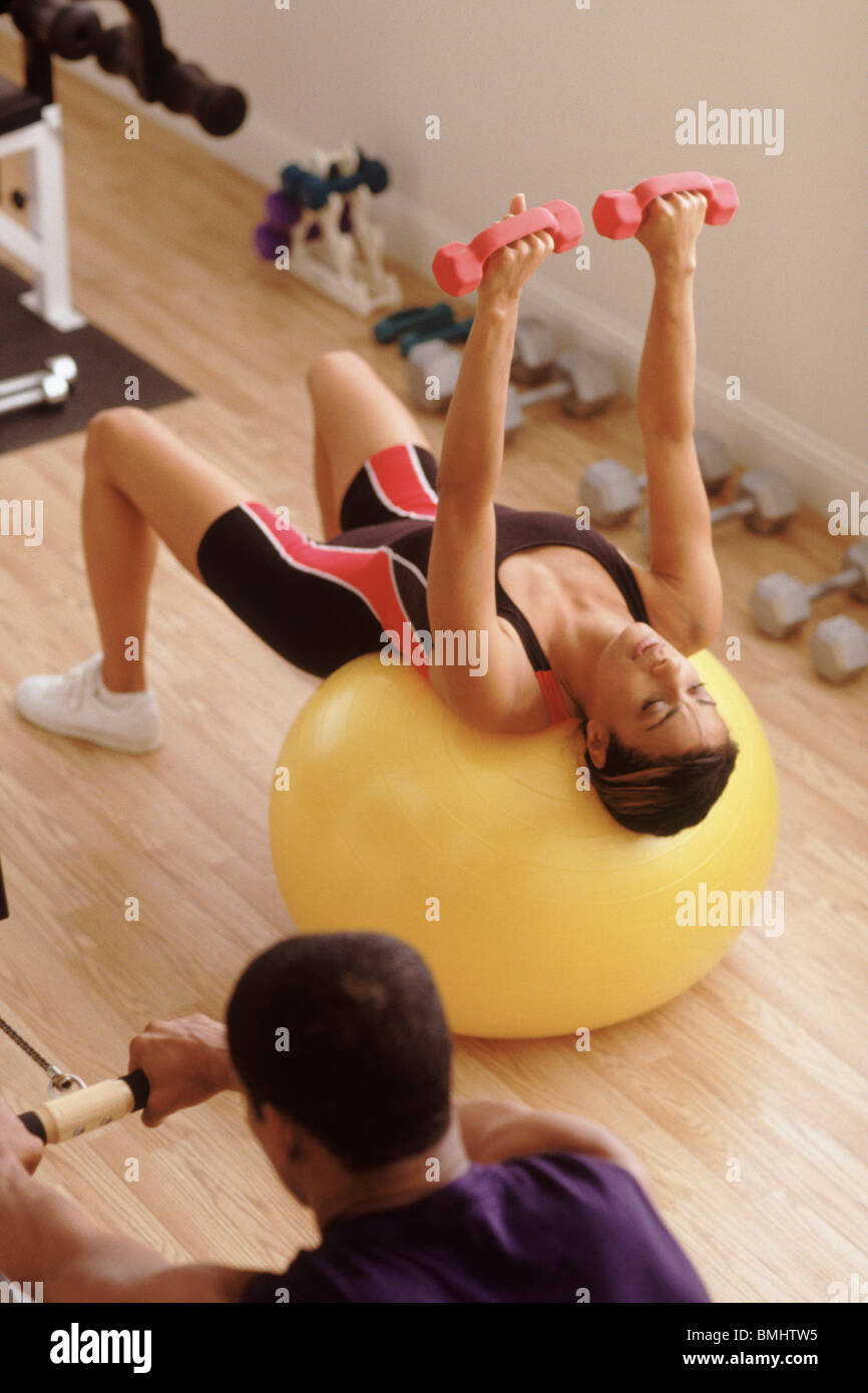 People working out in a gym Stock Photo - Alamy