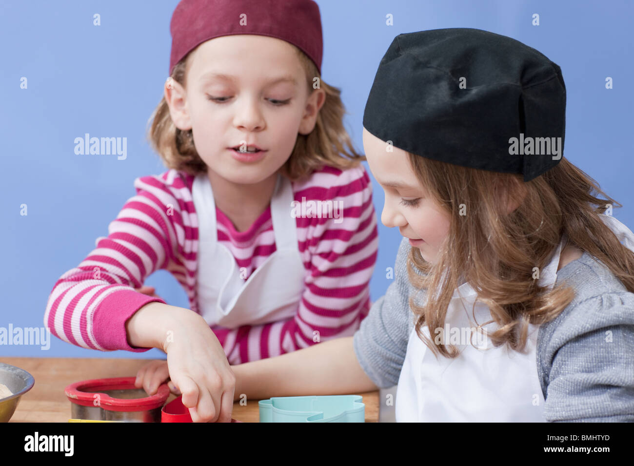 Young girls baking Stock Photo - Alamy