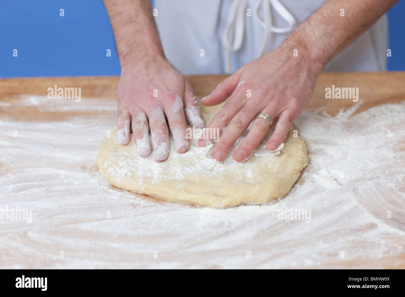 Mans hands kneading dough hi-res stock photography and images - Alamy