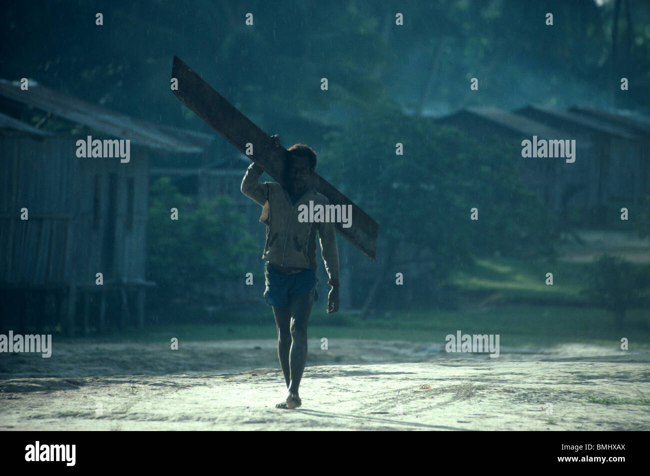 Papuan man in a resettlement camp, West Papua. Indonesia Stock Photo ...
