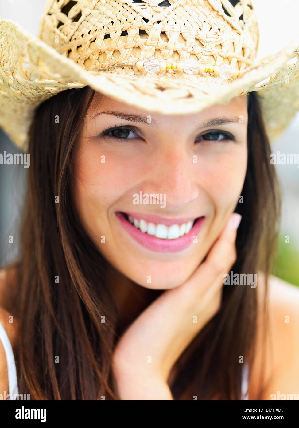 Woman wearing straw hat Stock Photo - Alamy