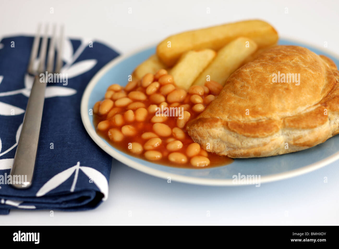 Cornish Pasty with Chips and Beans Stock Photo - Alamy