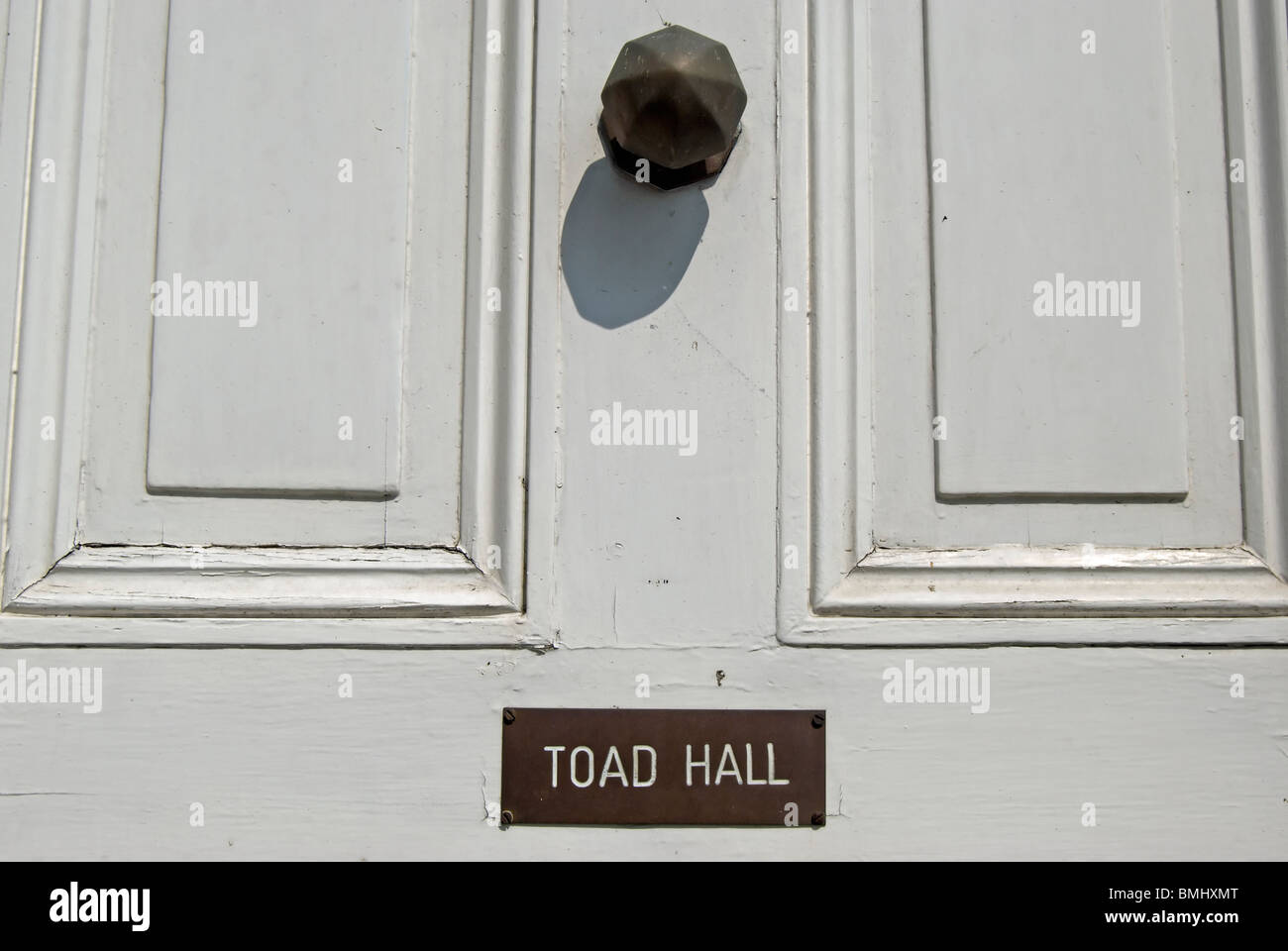 white front door with toad hall name plate, in isleworth, middlesex ...