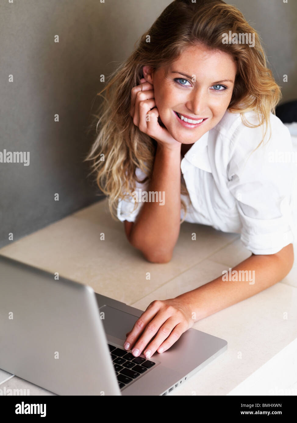 Woman typing on laptop Stock Photo - Alamy