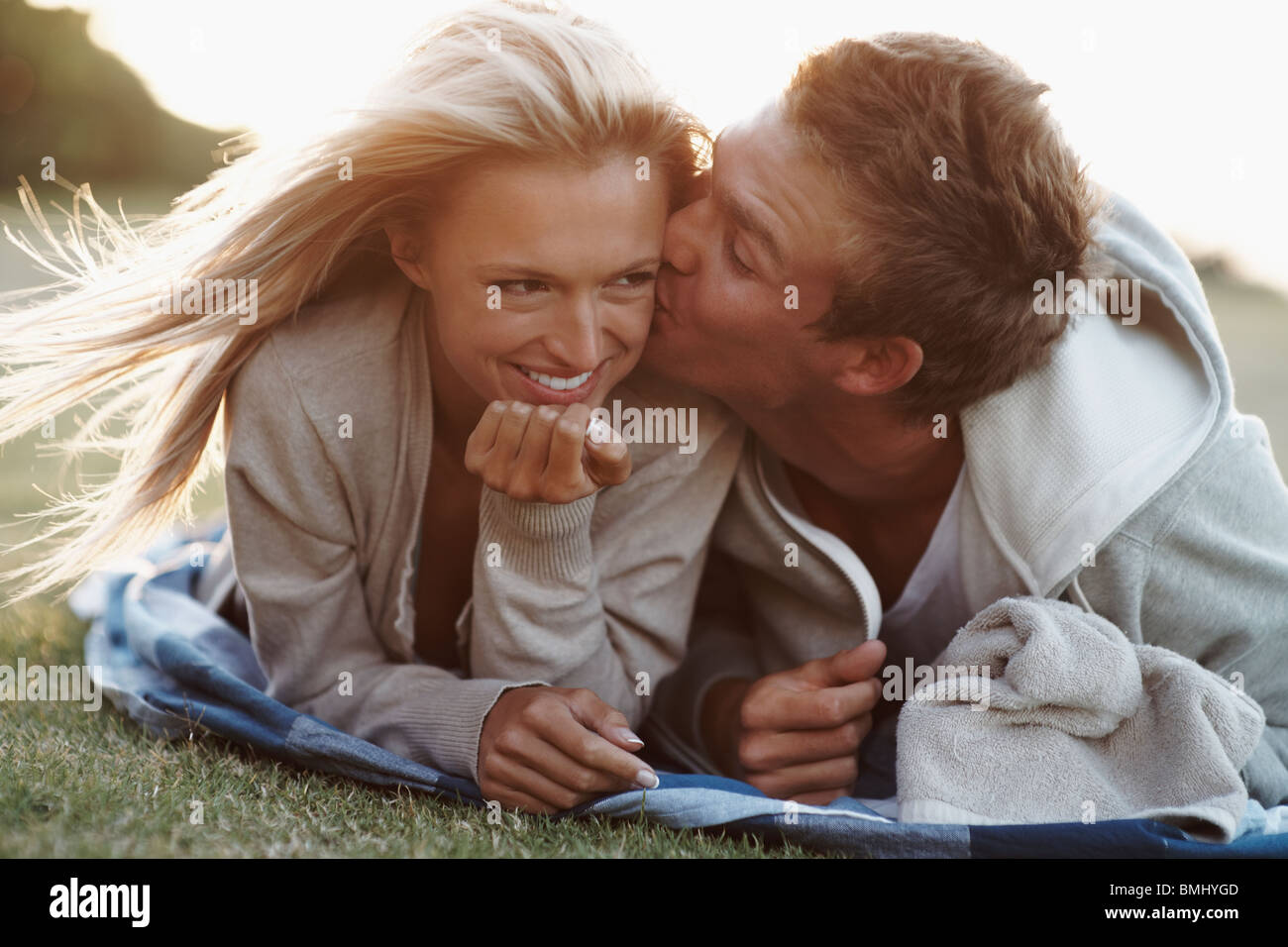Man kissing girlfriend Stock Photo - Alamy
