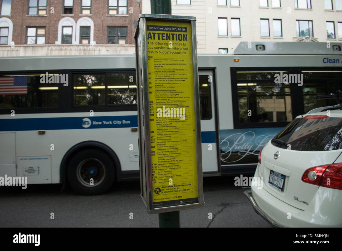 A sign on a bus stop outside of Central Park in New York warns of ...