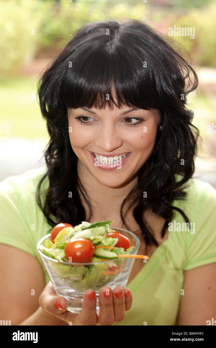 Young Woman Eating Salad. Model Released Stock Photo - Alamy