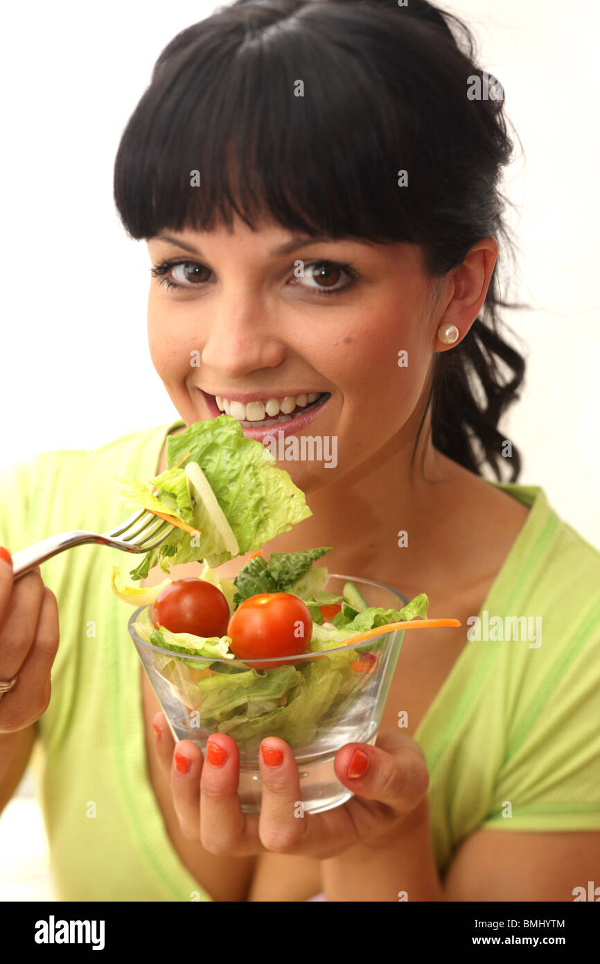 Young Woman Eating Salad. Model Released Stock Photo - Alamy