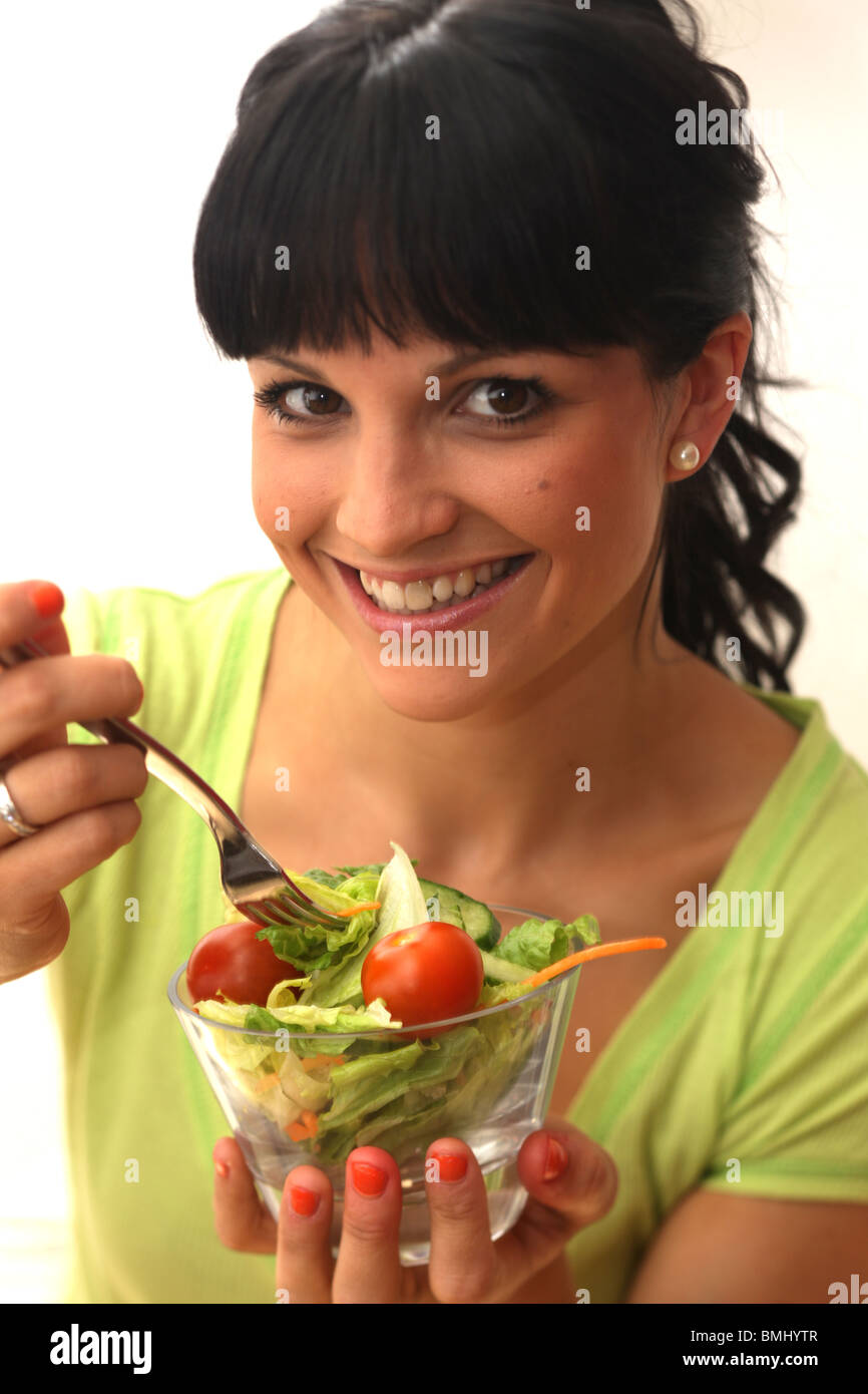 Young Woman Eating Salad. Model Released Stock Photo - Alamy