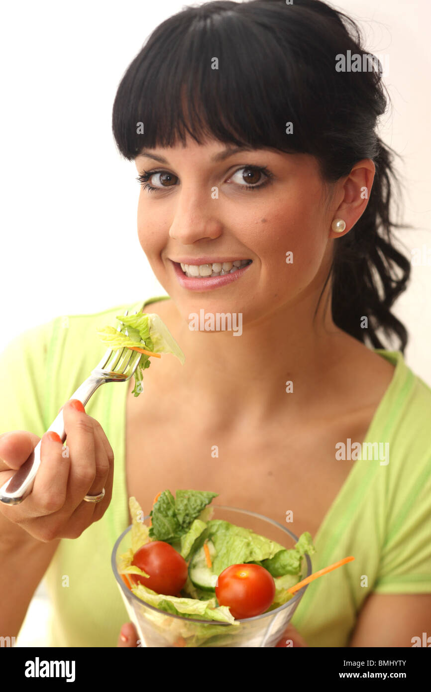 Young Woman Eating Salad. Model Released Stock Photo - Alamy