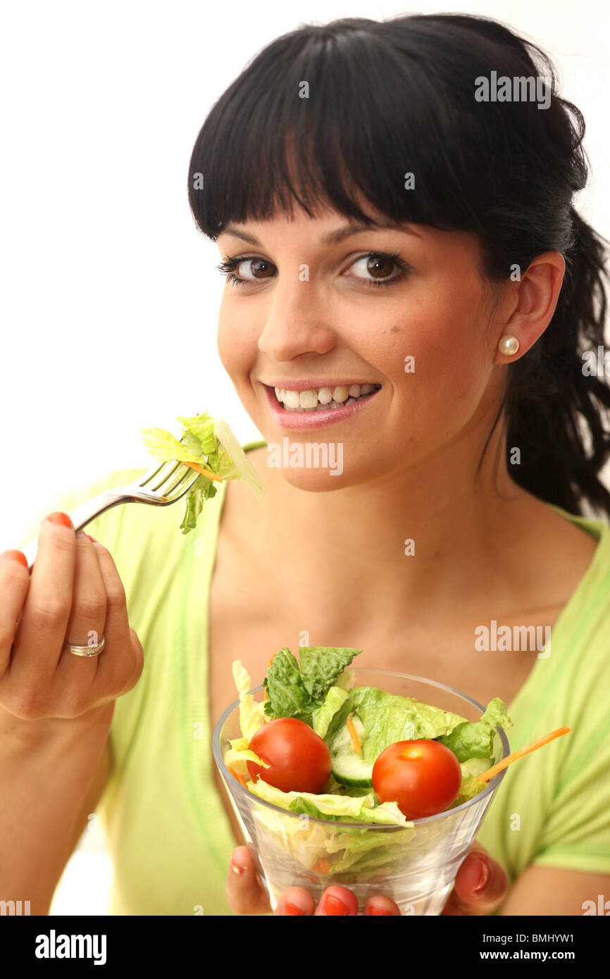 Young Woman Eating Salad. Model Released Stock Photo - Alamy