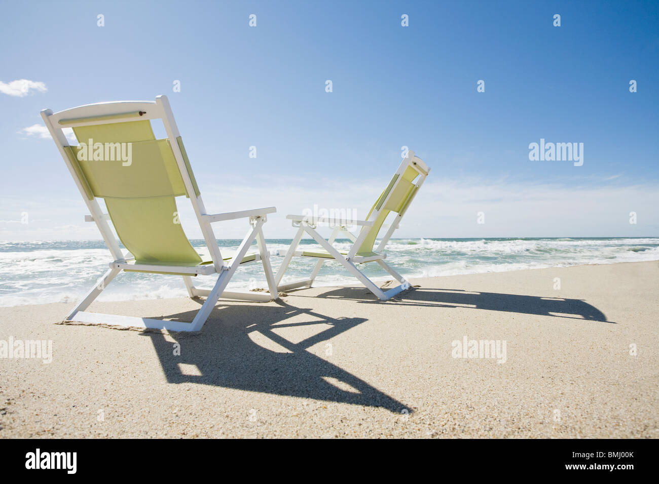 Beach chairs by the ocean Stock Photo - Alamy
