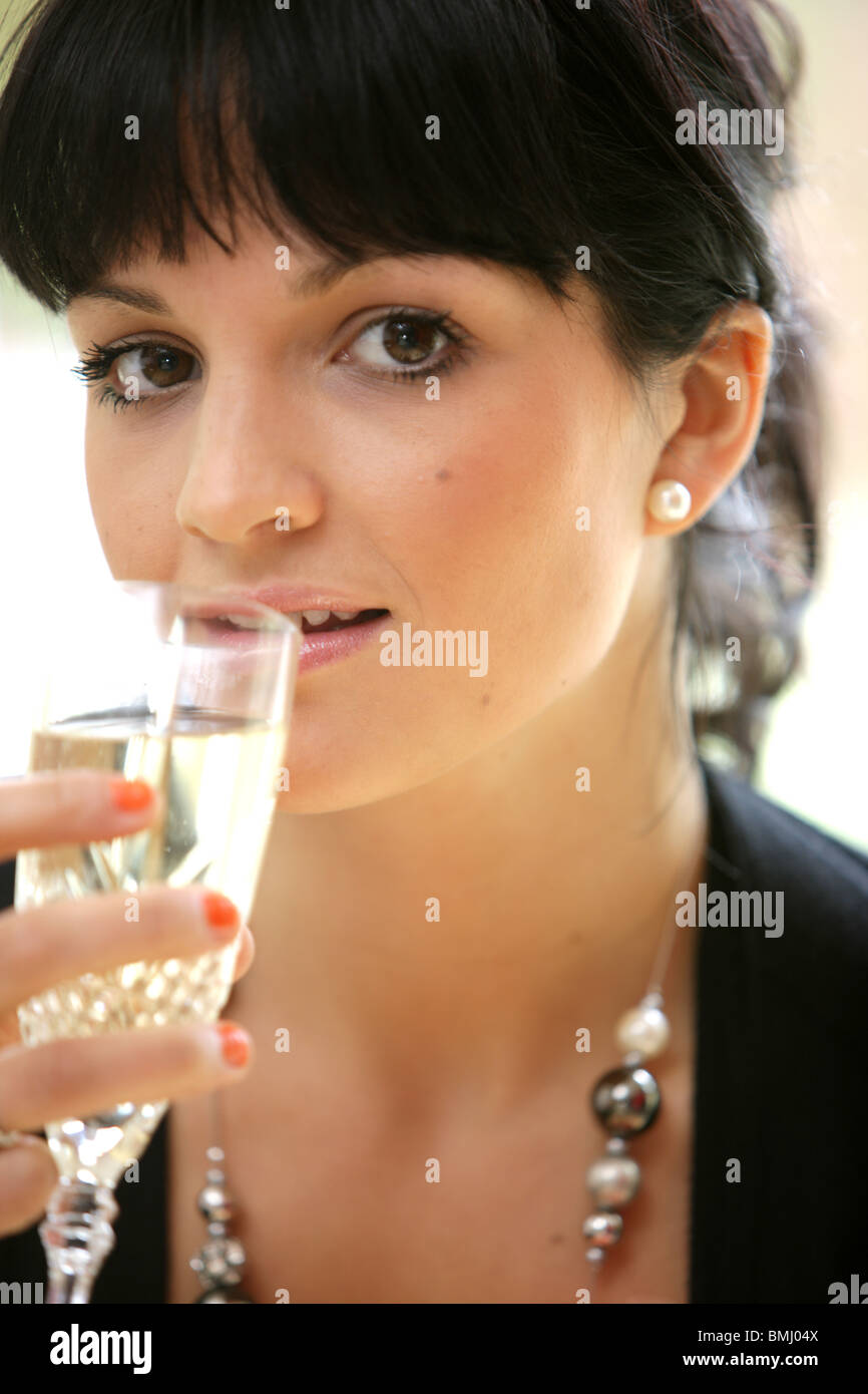 Young Woman Drinking Champagne. Model Released Stock Photo - Alamy