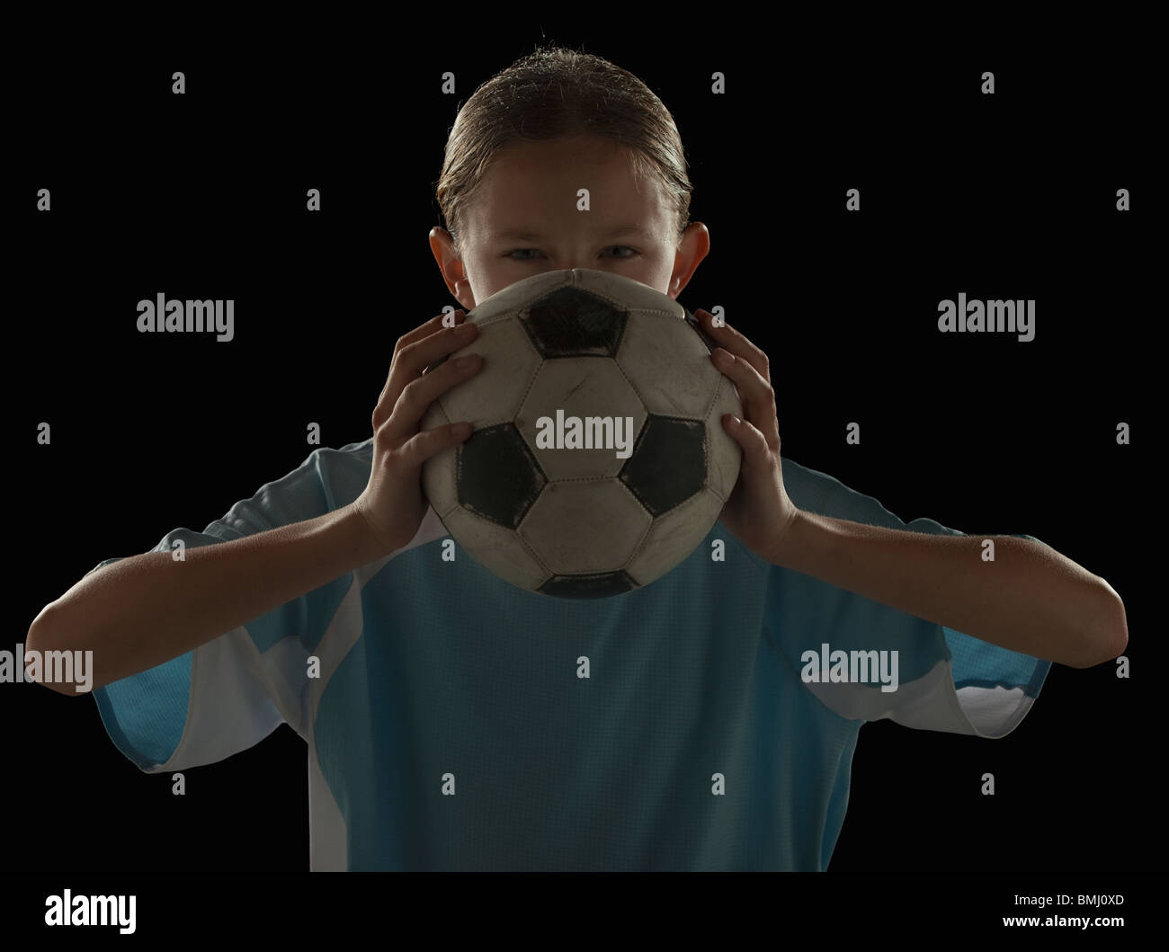 Soccer player and ball Stock Photo - Alamy