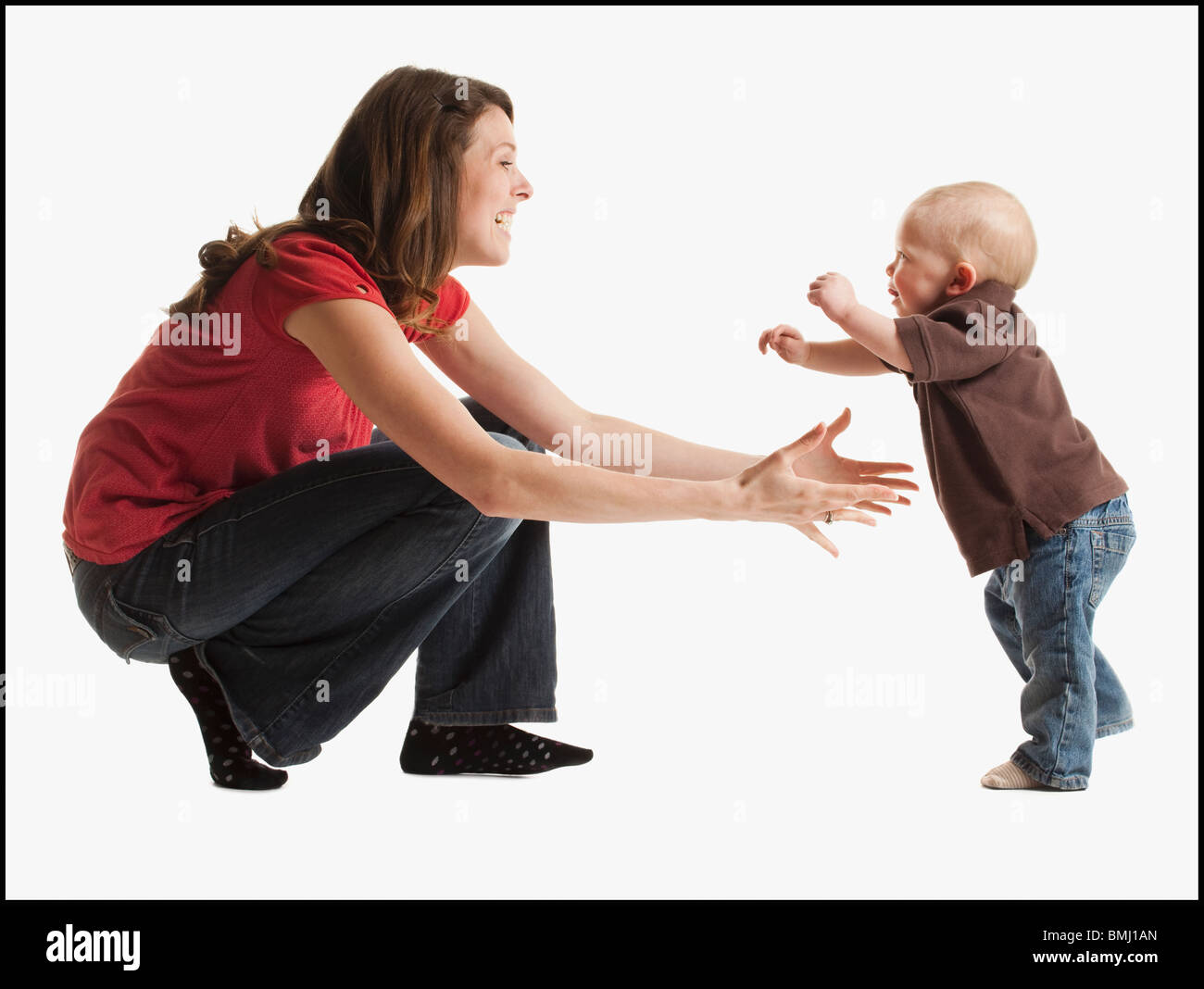Toddler learning to walk Stock Photo - Alamy