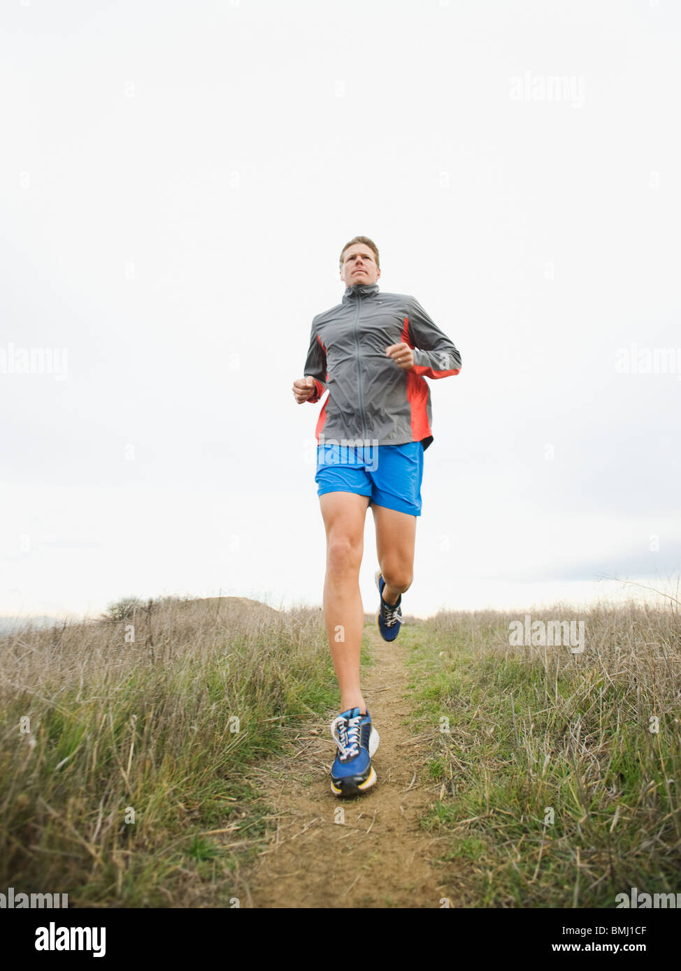 Person running on trail Stock Photo - Alamy