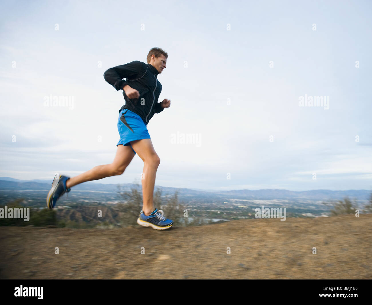 Person running on trail Stock Photo - Alamy