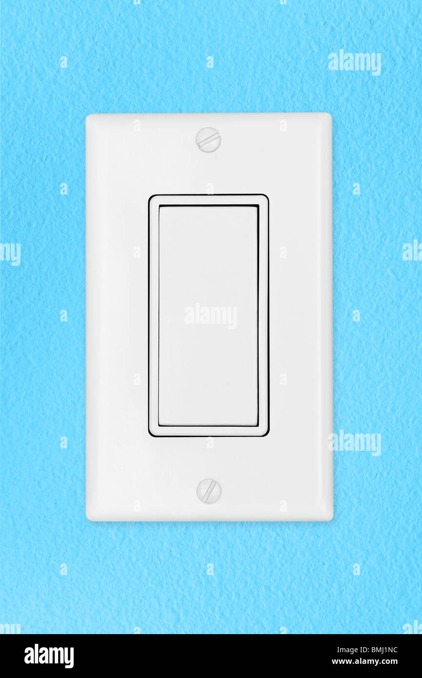 A modern toggle electrical light switch on a blue wall Stock Photo - Alamy