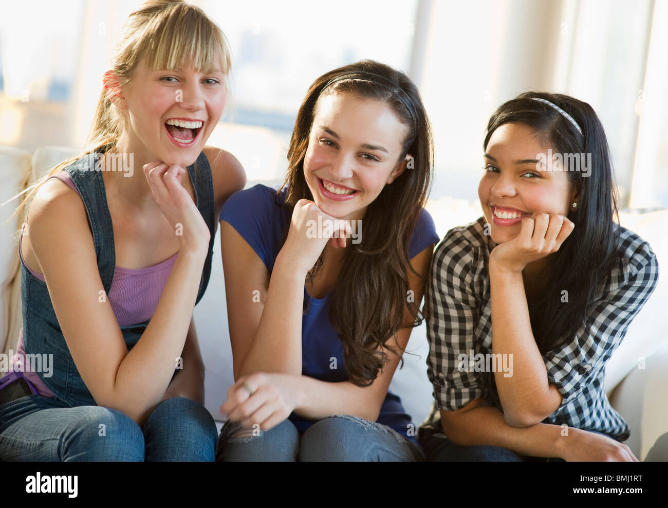 Friends laughing Stock Photo - Alamy