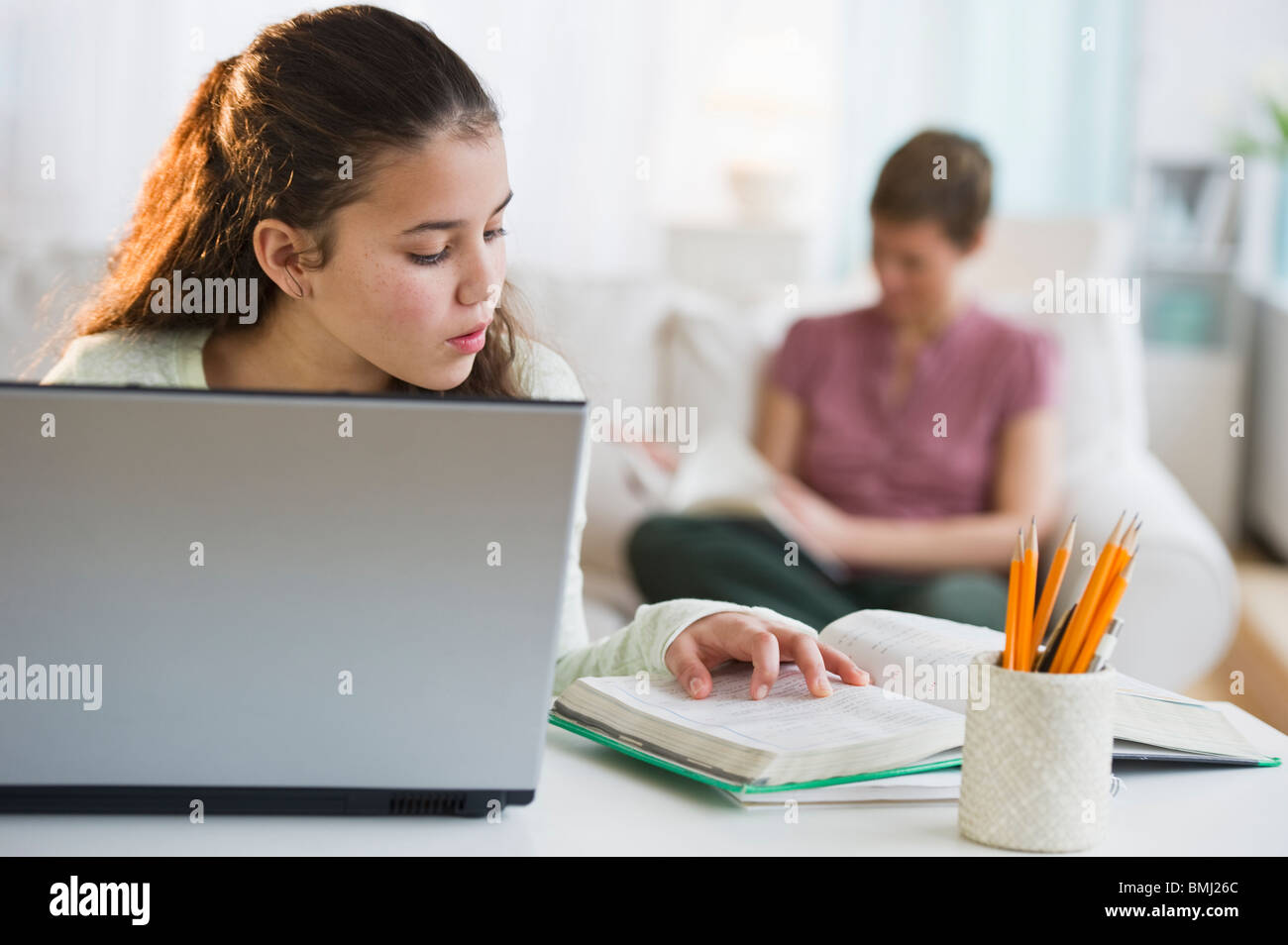 Young girl doing homework Stock Photo - Alamy