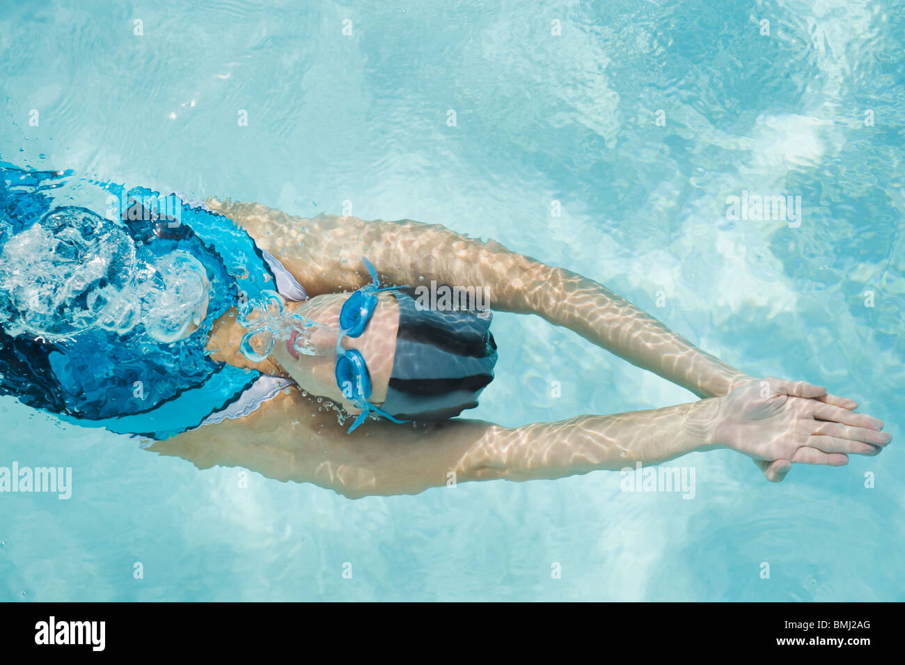Woman swimming on her back Stock Photo - Alamy