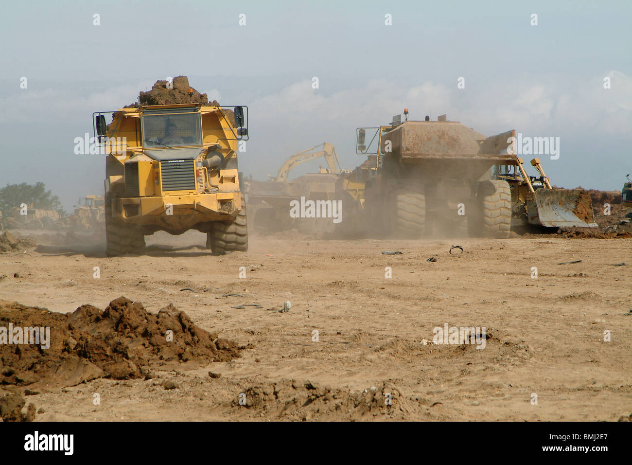 Volvo dump trucks working on a building site in England Stock Photo - Alamy