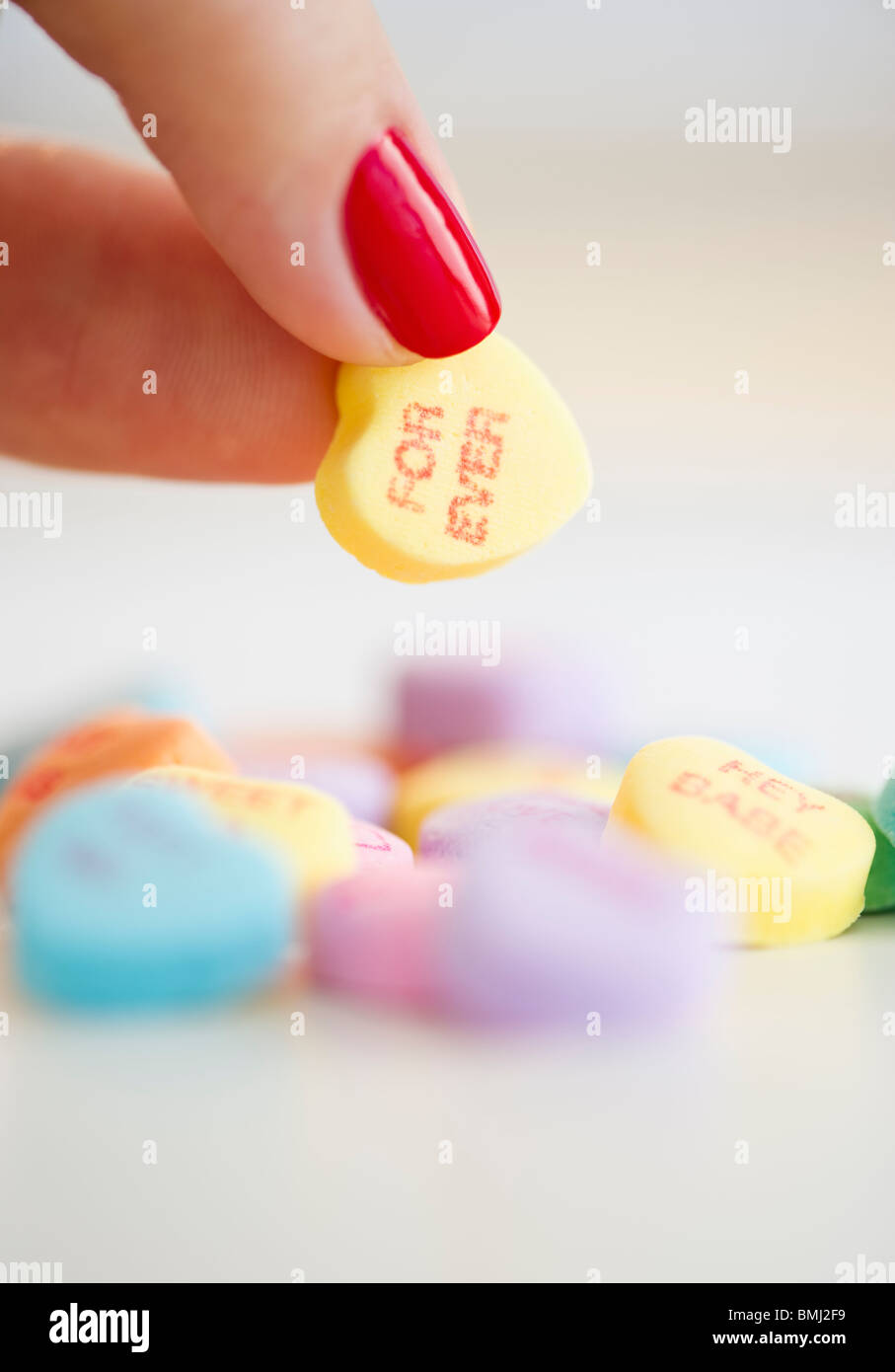 Candies hand hi-res stock photography and images - Alamy