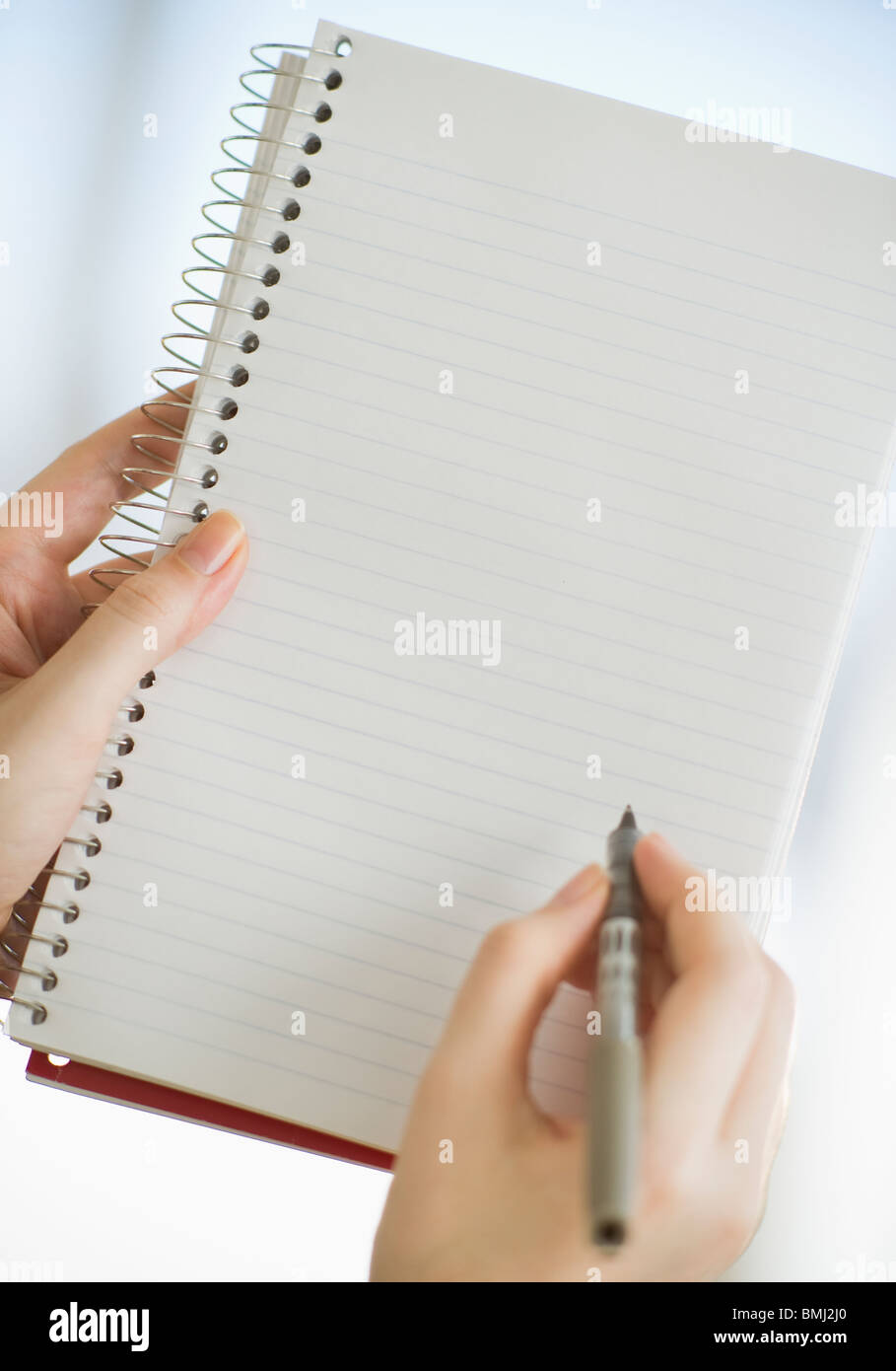 Lined paper in notebook Stock Photo - Alamy