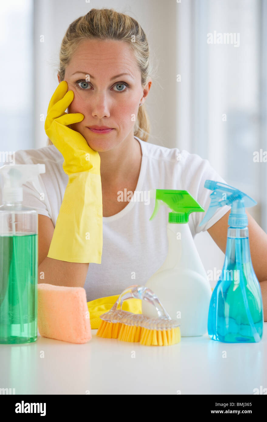 Woman and cleaning supplies Stock Photo - Alamy