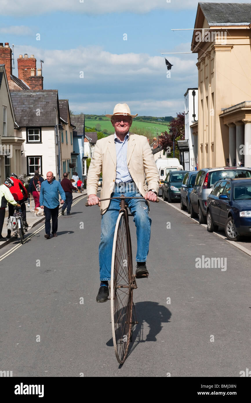 Mr Roger Collings riding his original Victorian penny-farthing bicycle ...