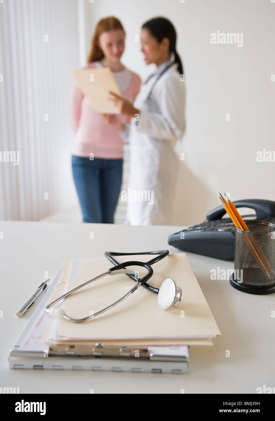 Female doctor patients medical record hi-res stock photography and ...