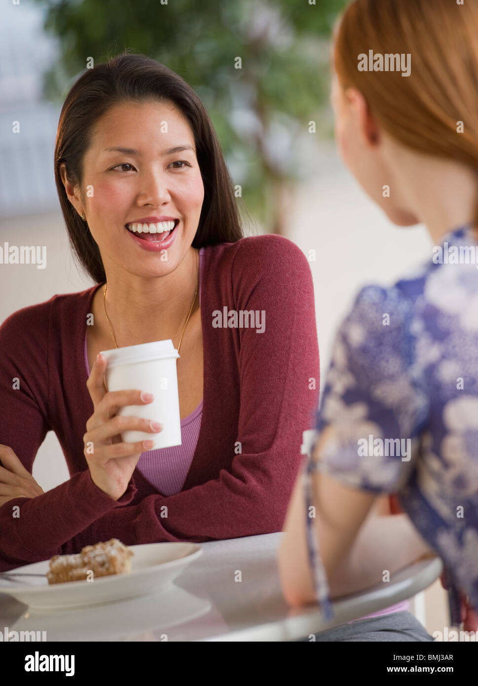 Friends at a cafe Stock Photo - Alamy