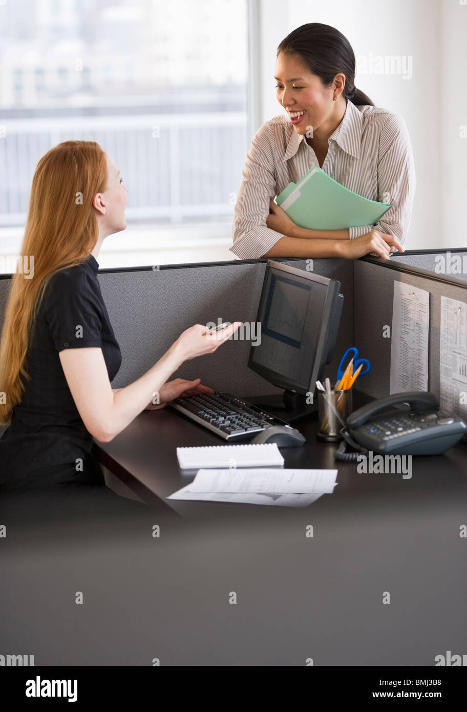 Businesswomen socializing at work Stock Photo - Alamy