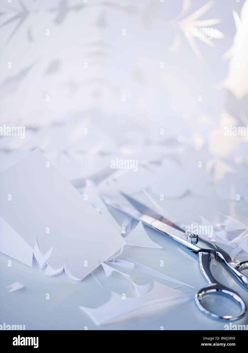 Scissors and paper snowflakes Stock Photo - Alamy