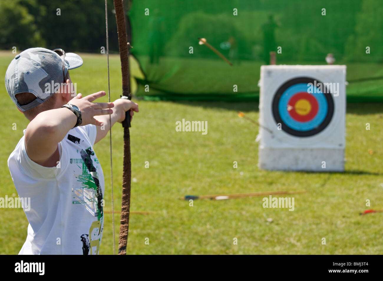 Boy trying archery at activity day Stock Photo - Alamy
