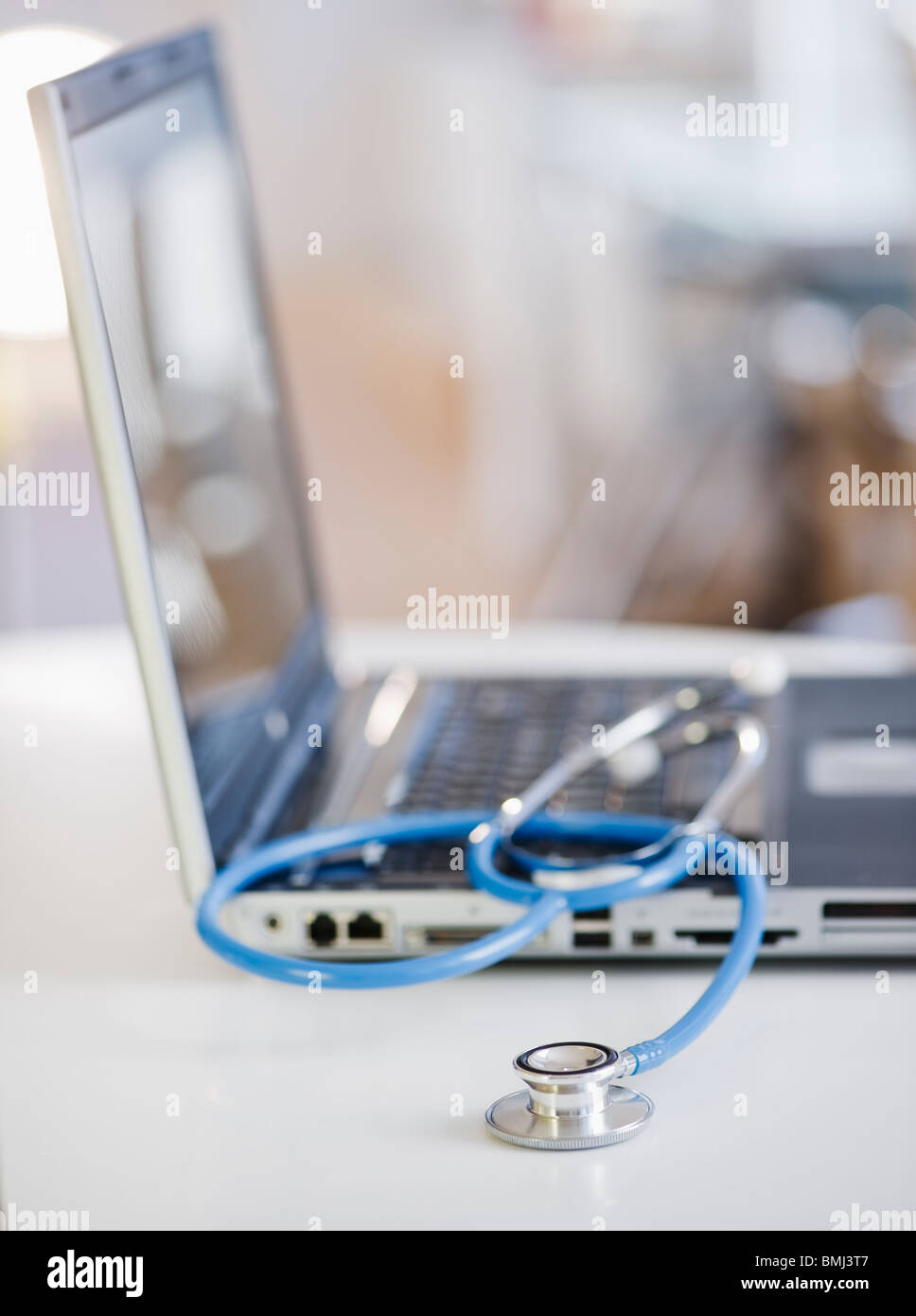 Stethoscope on laptop Stock Photo - Alamy