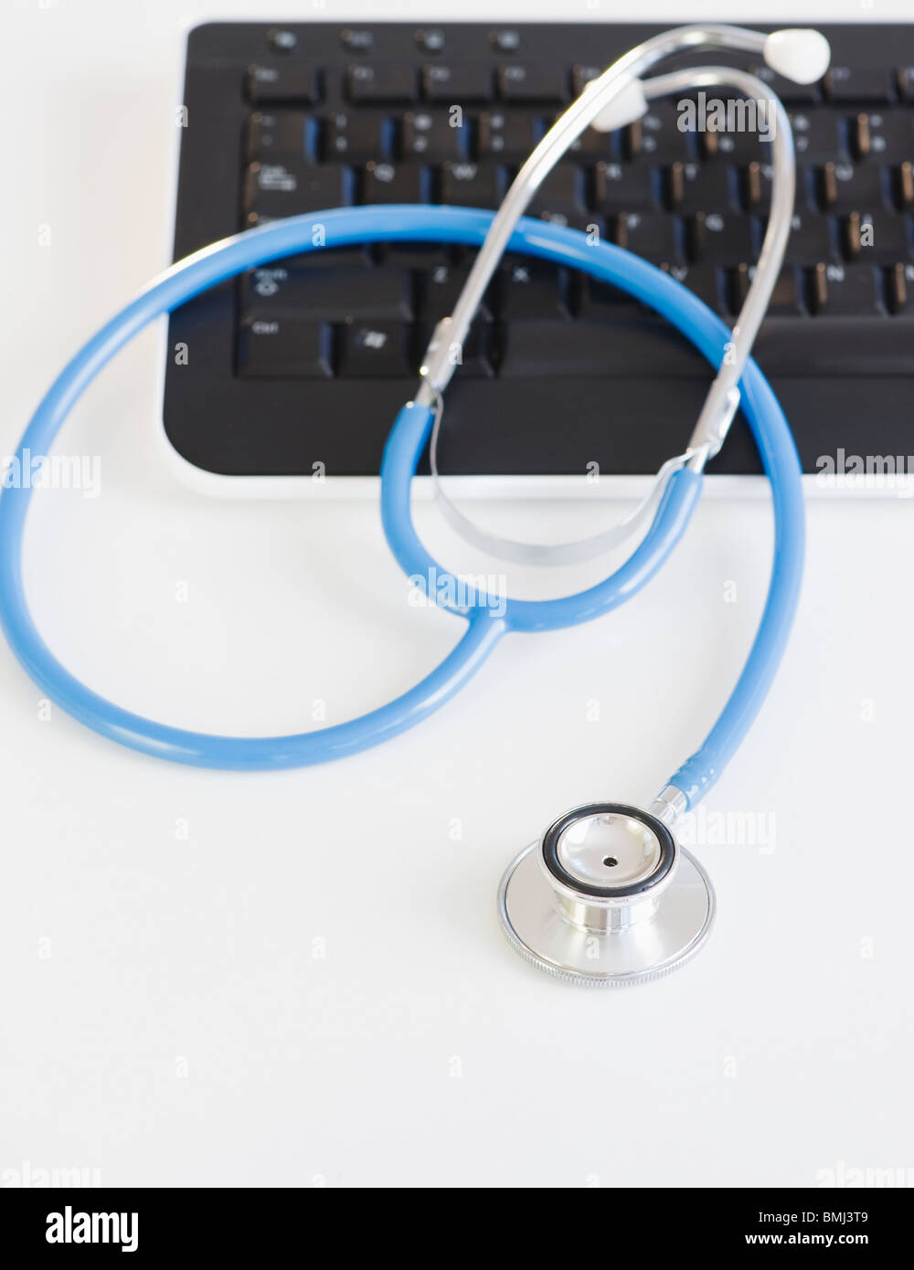 Stethoscope on laptop Stock Photo - Alamy