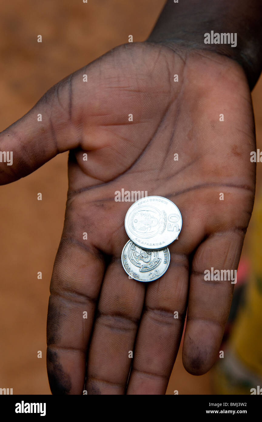 Hand with coins in. Rwanda Stock Photo - Alamy