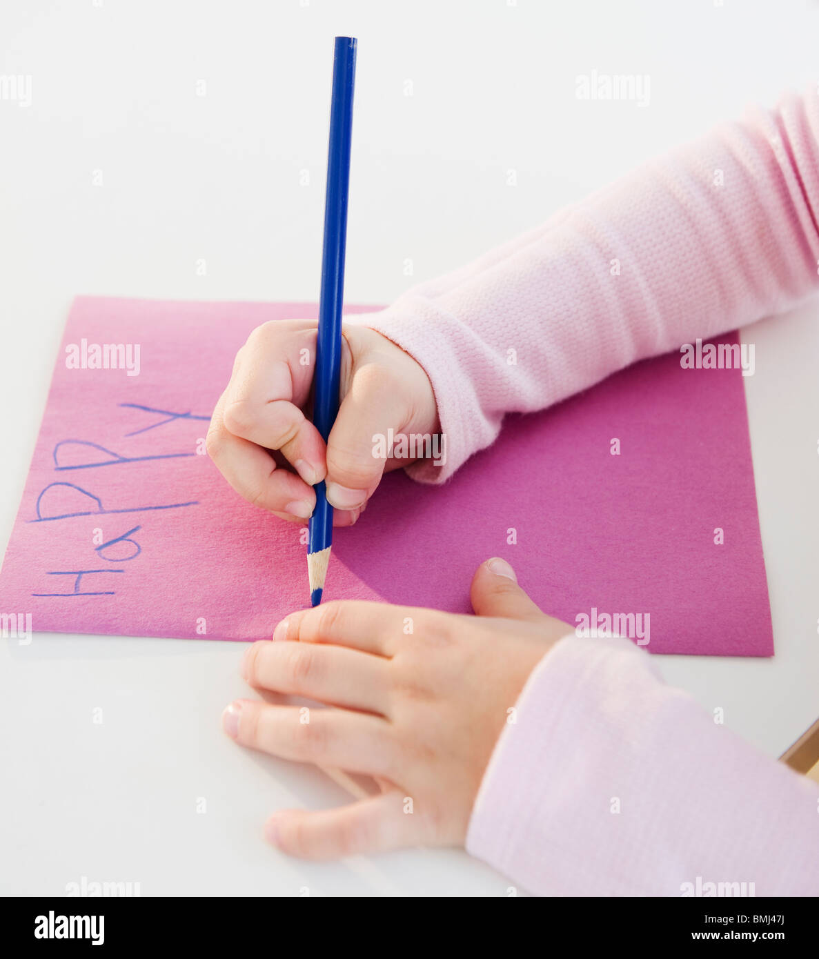 Child writing a birthday card Stock Photo - Alamy