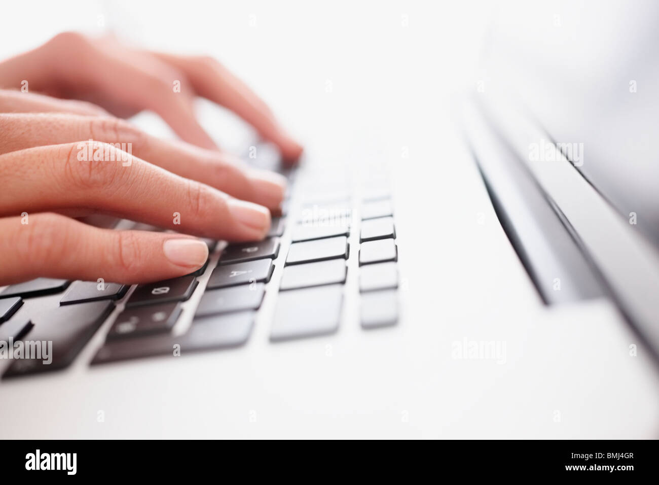 Fingers typing on keyboard Stock Photo - Alamy