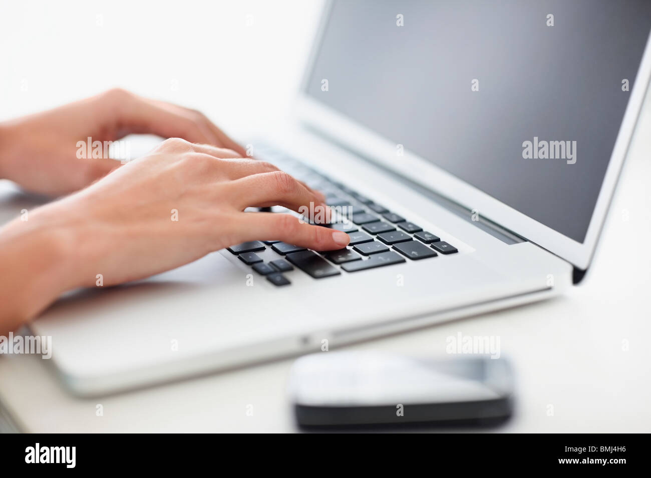 Fingers typing on keyboard Stock Photo - Alamy