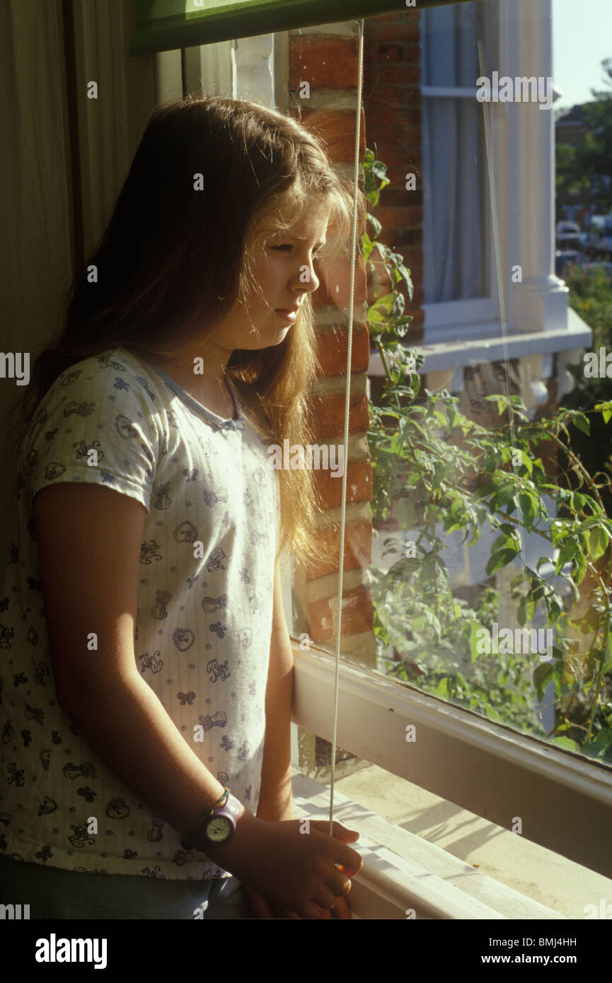 girl looking out of the window Stock Photo - Alamy