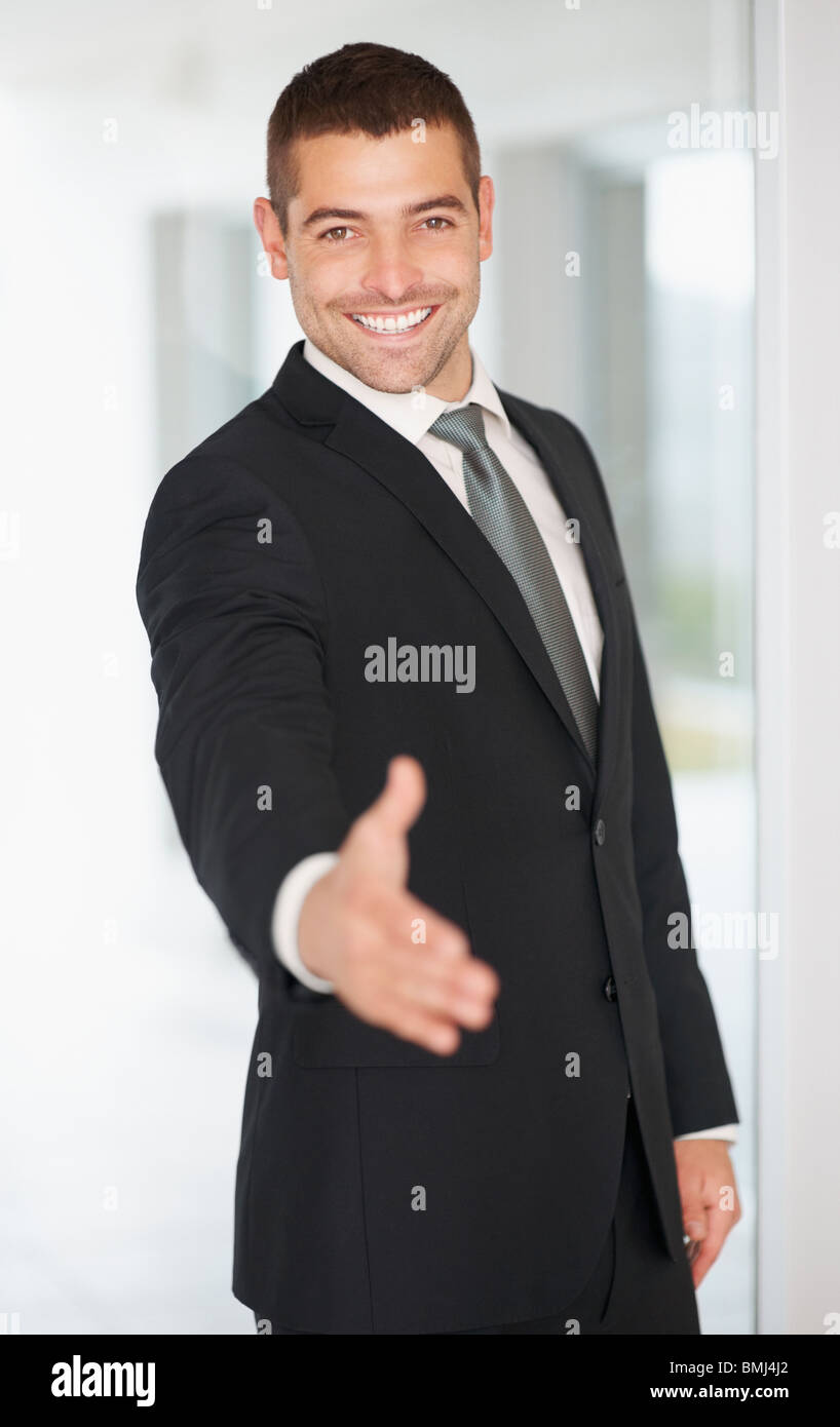 Businessman waiting to shake hands Stock Photo - Alamy