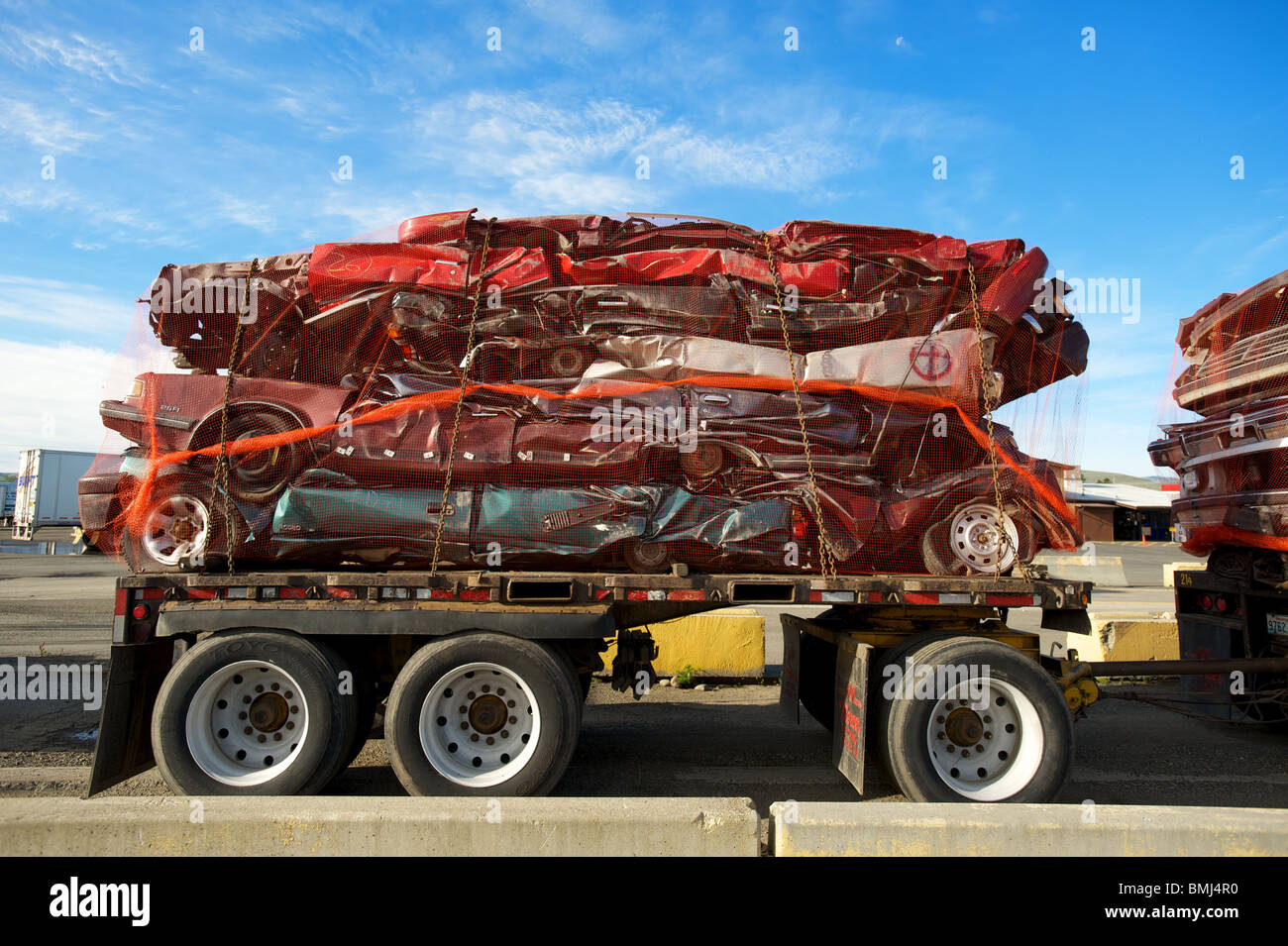 Crushed cars on a truck bed Stock Photo - Alamy