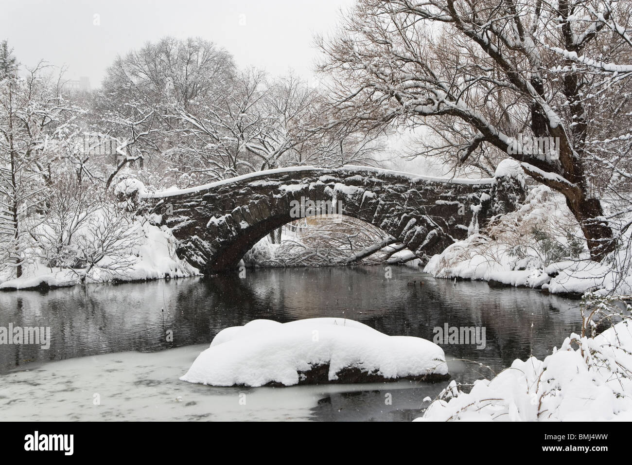 Lake and bridge in winter Stock Photo - Alamy