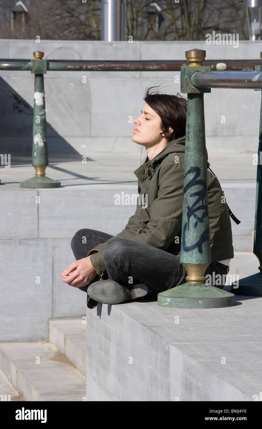 teenager sitting in sun Stock Photo - Alamy