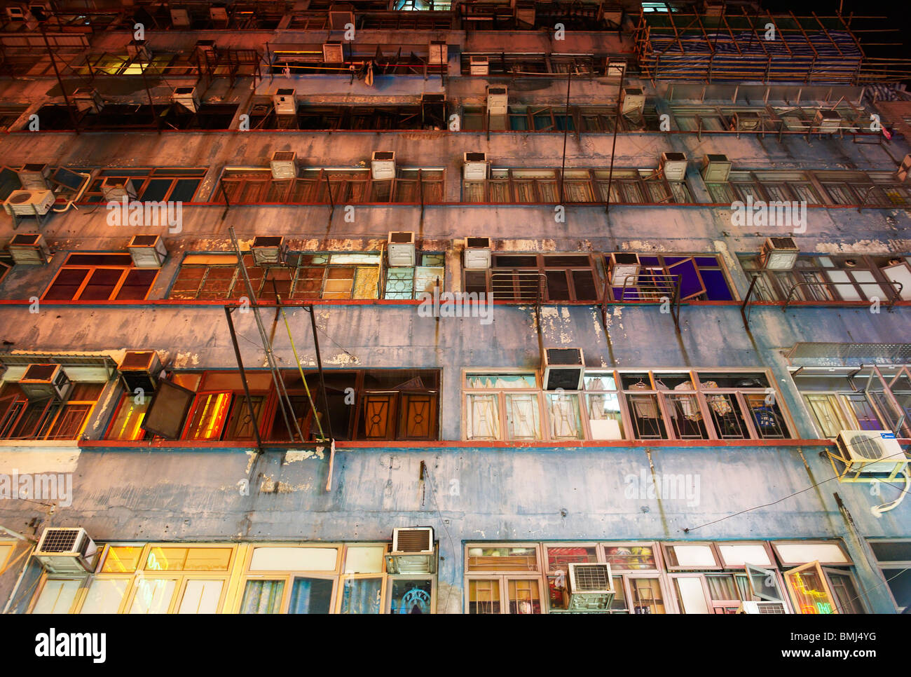 The back of an old residential building, showing wooden window frames ...