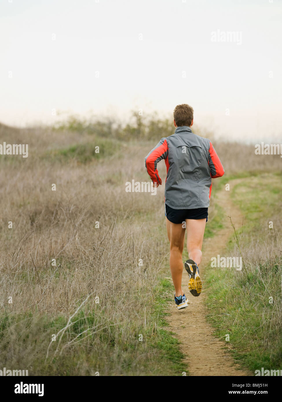 Person running on trail Stock Photo - Alamy